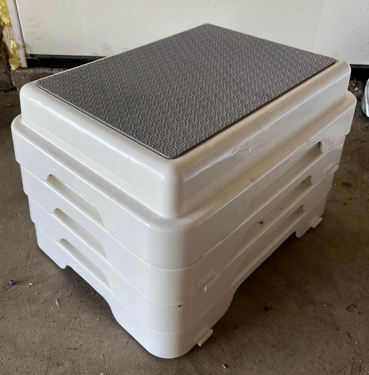 Three plastic step stools with a non-slip top surface | Medical ...